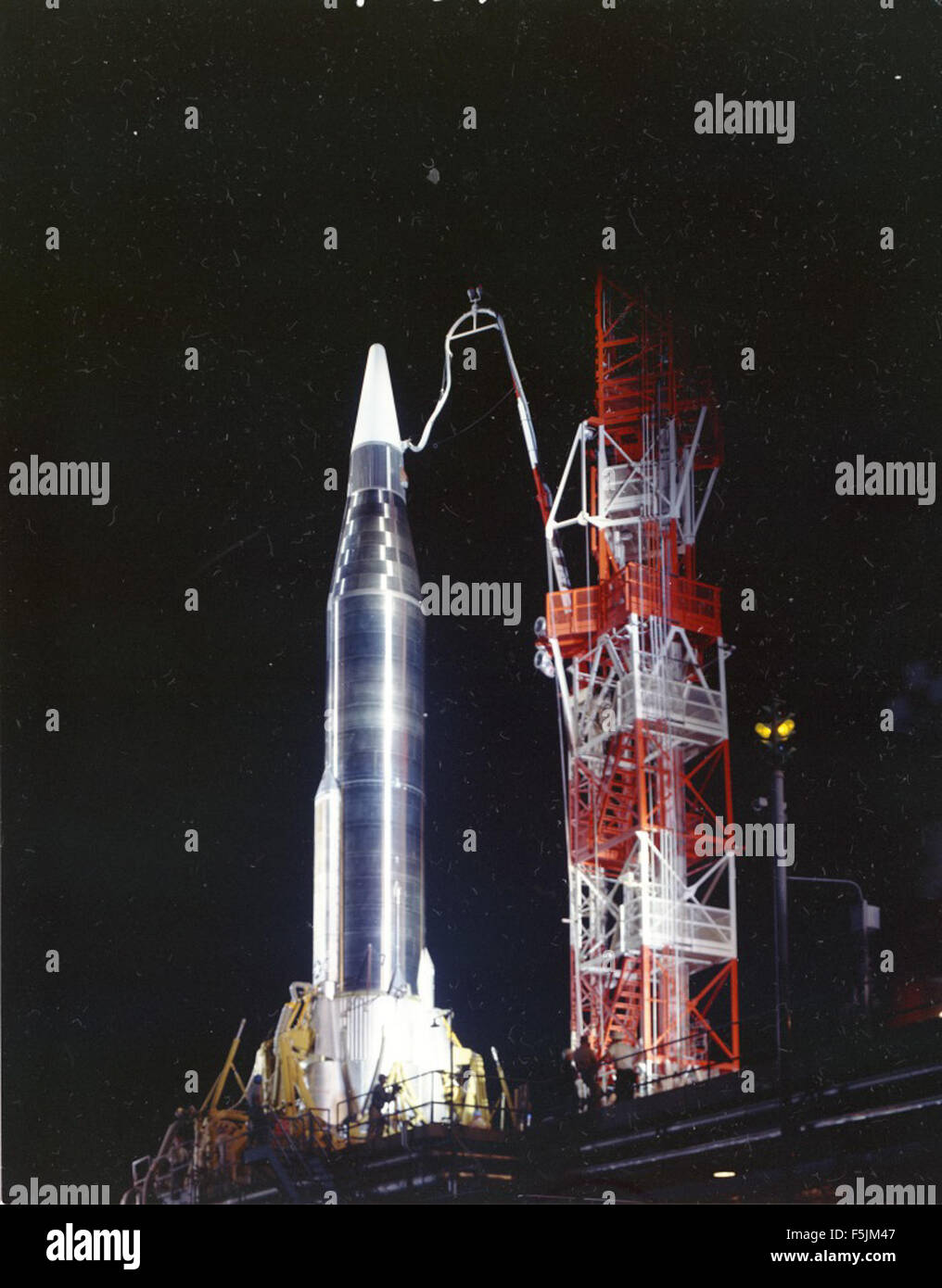 The Atlas 7D rocket is shown undergoing a static test at the FRF, with ...