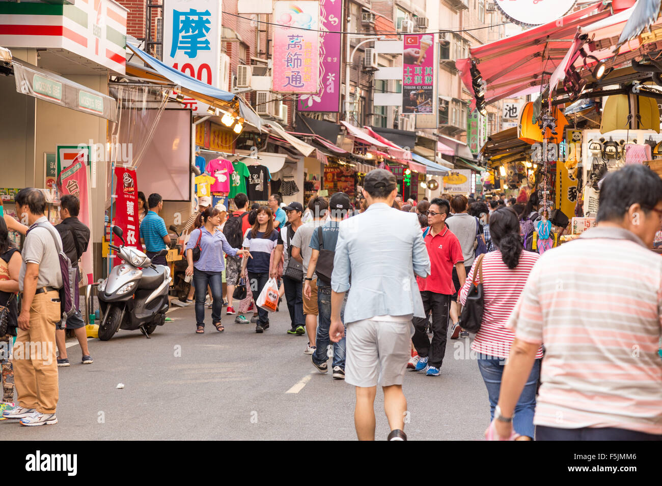 NEW TAIPEI CITY, TAIWAN - SEPTEMBER 11, 2015: Shoppers walking through ...