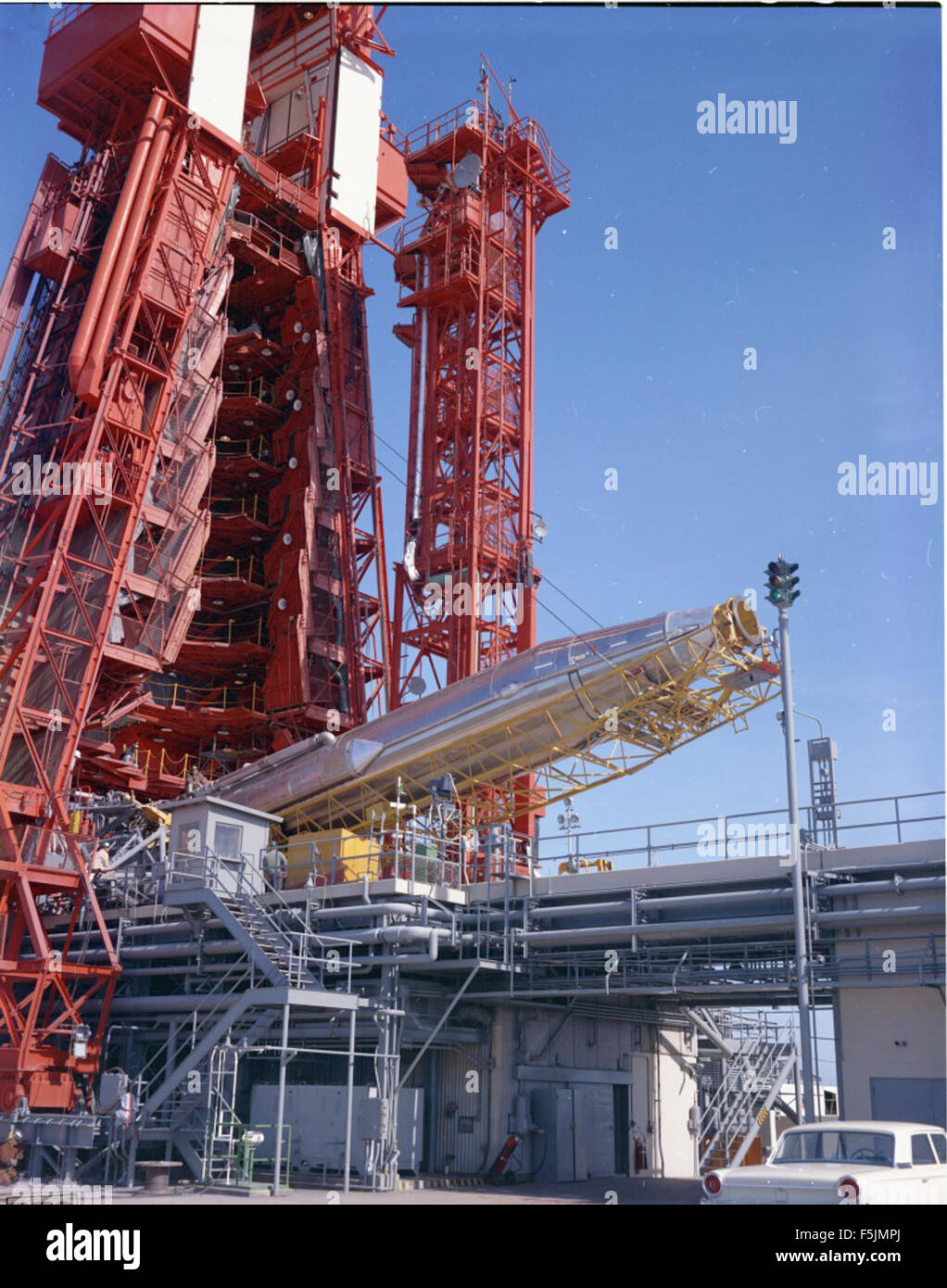 The image details the erection of the Atlas 99D booster, an essential ...