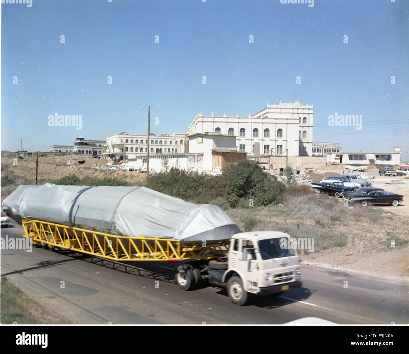 Photo showing Atlas 9C missile being transported on a highway, with the ...