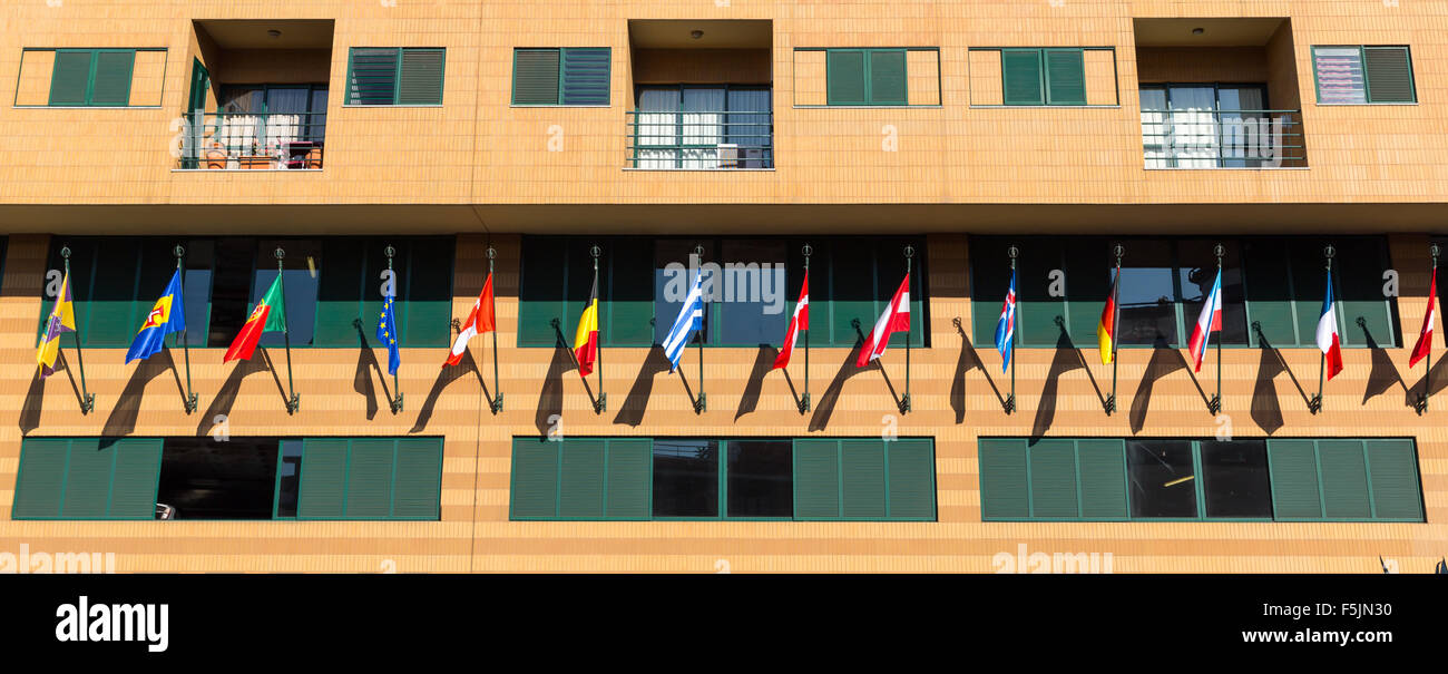 Building with flags of different countries close up Stock Photo - Alamy