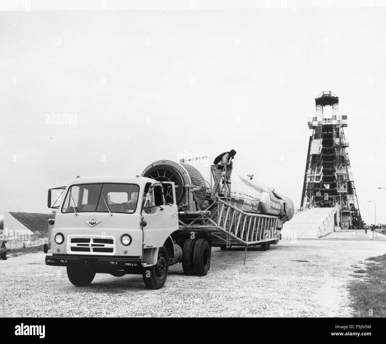 An image showing the erection of the Atlas 9C missile, with a trailer ...