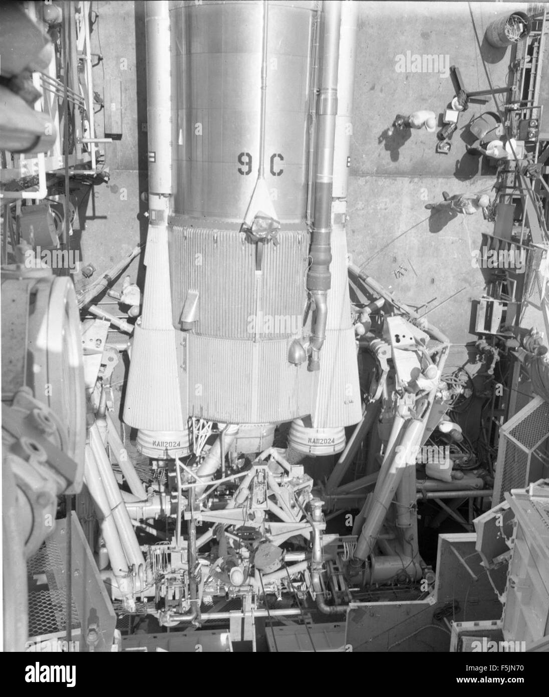 The image shows the erection of the Atlas 9C missile at AMR, with a ...