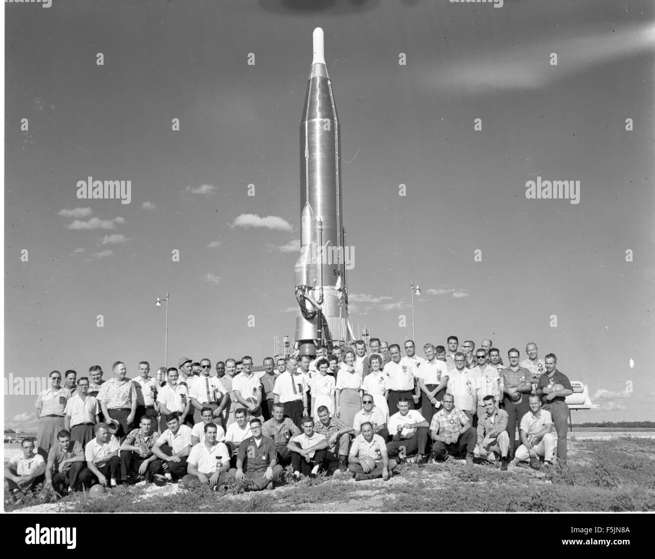 This image shows workers handling an Atlas missile system, emphasizing ...