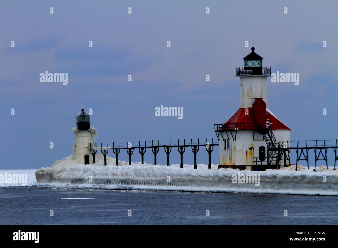 Beautiful winter scene the with St Joseph lighthouse covered in snow in ...