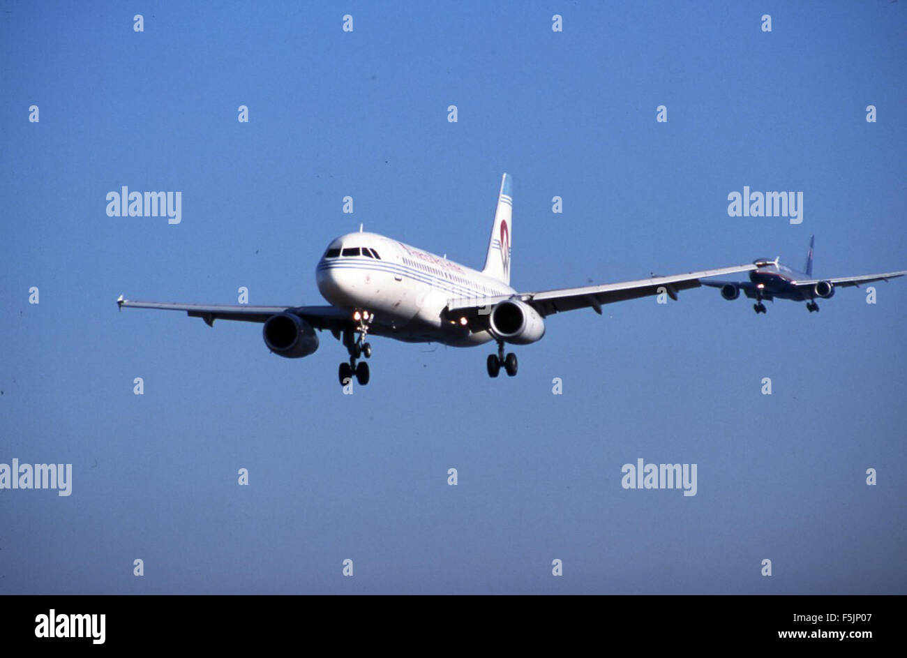 This image features an Airbus A320-231 aircraft (serial number 67 ...
