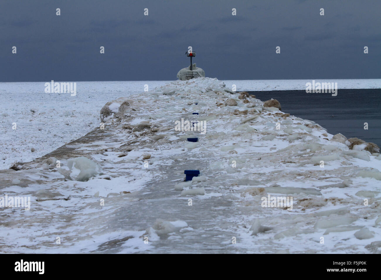 Snow and ice covering Lake Michigan at the St. Joseph North Pier head ...