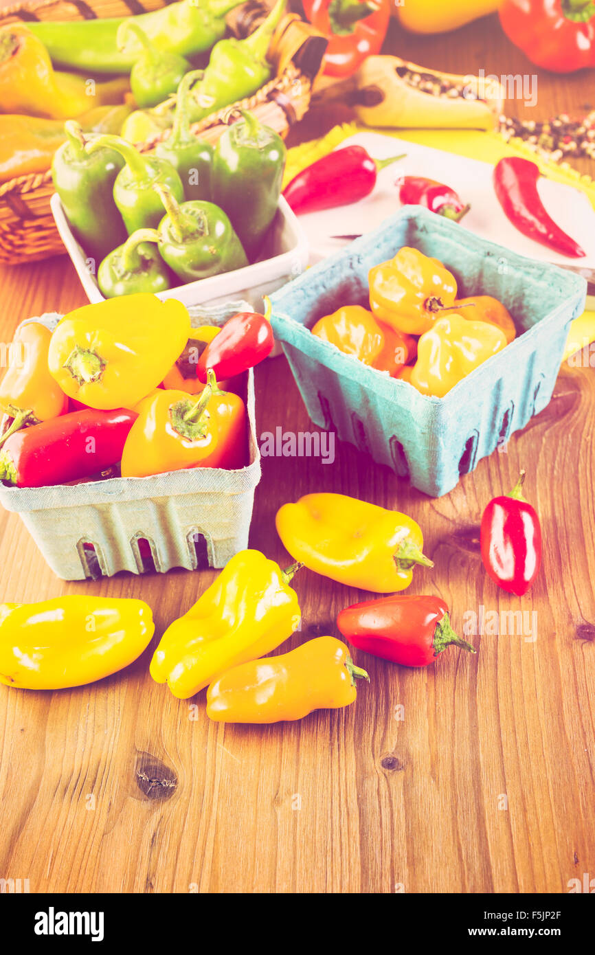 Variety of fresh organic peppers on the table Stock Photo - Alamy