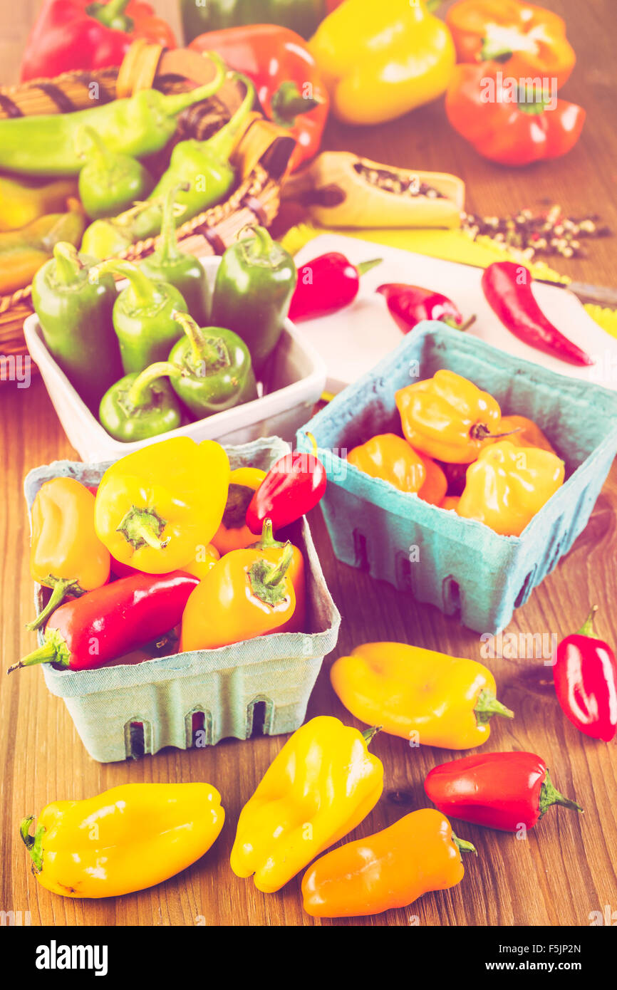 Variety of fresh organic peppers on the table Stock Photo - Alamy