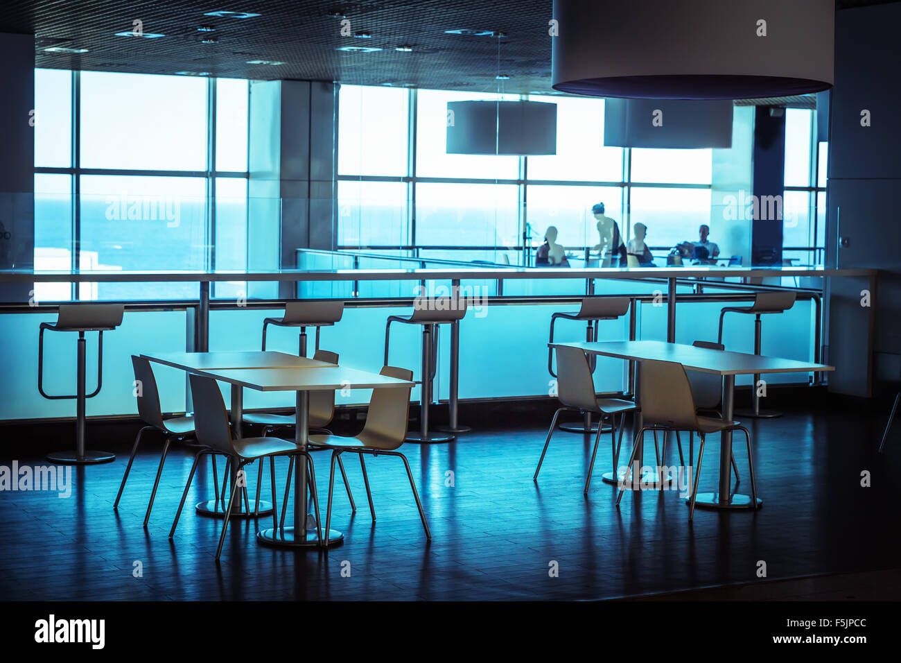 Several tables with chairs in the public dining-room Stock Photo - Alamy