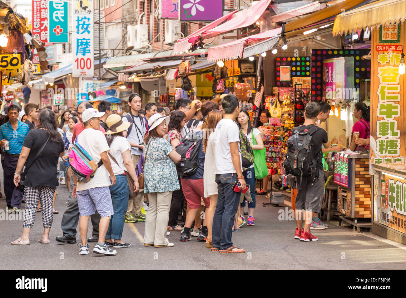 NEW TAIPEI CITY, TAIWAN - SEPTEMBER 11, 2015: Shoppers walking through ...