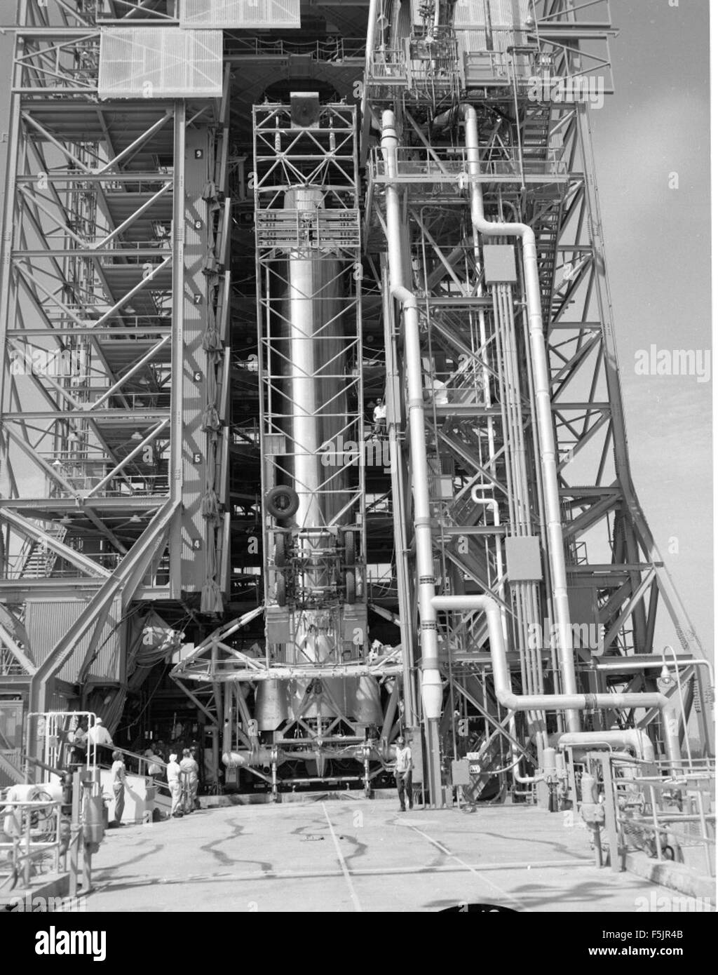 This image shows the Atlas Centaur AC 7 rocket being lowered onto its ...