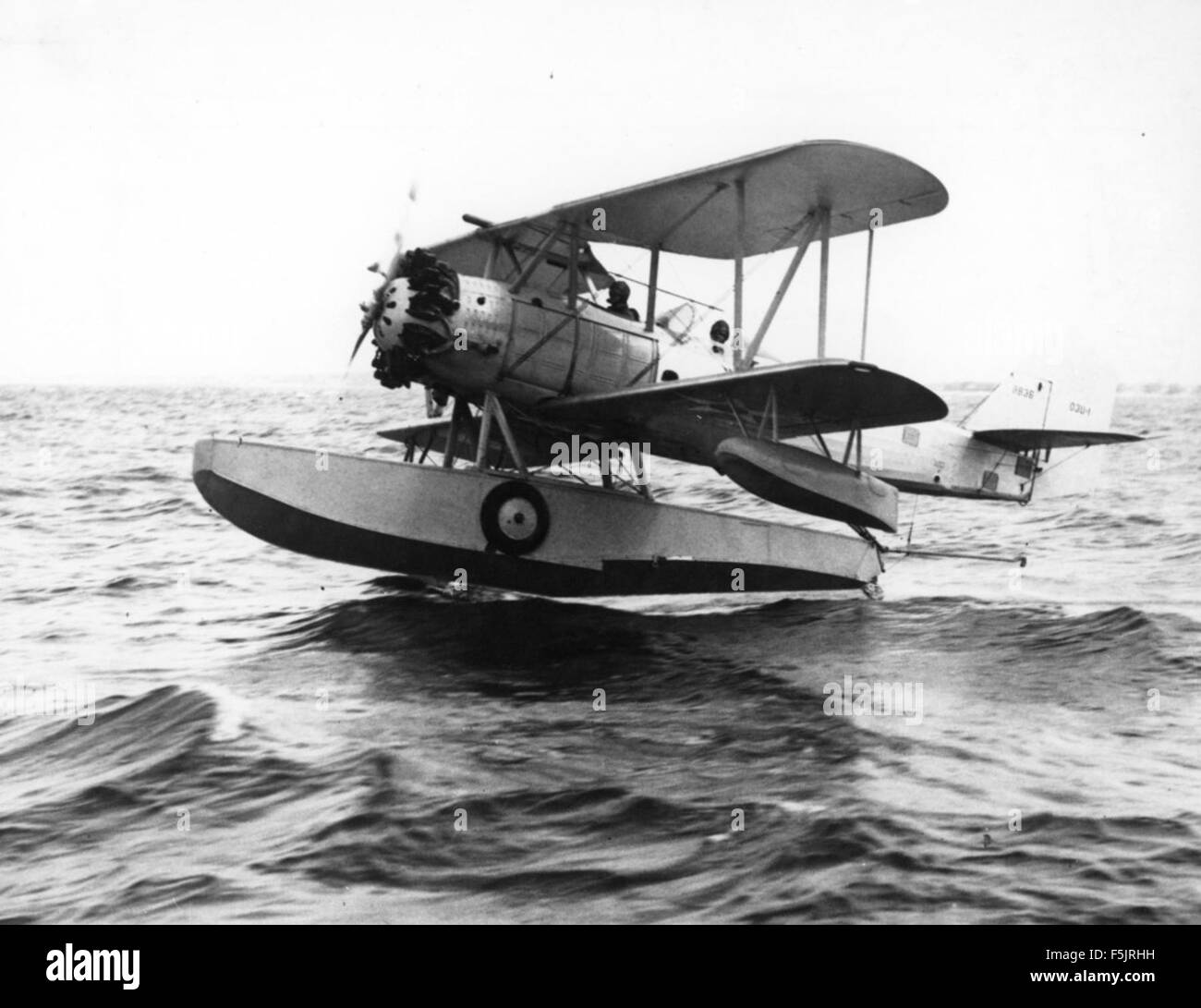 This image shows the Vought O3U-1 A-8836 aircraft testing a Grumman ...