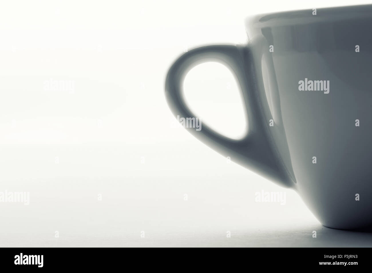 Closeup view of a coffee cup handle Stock Photo - Alamy