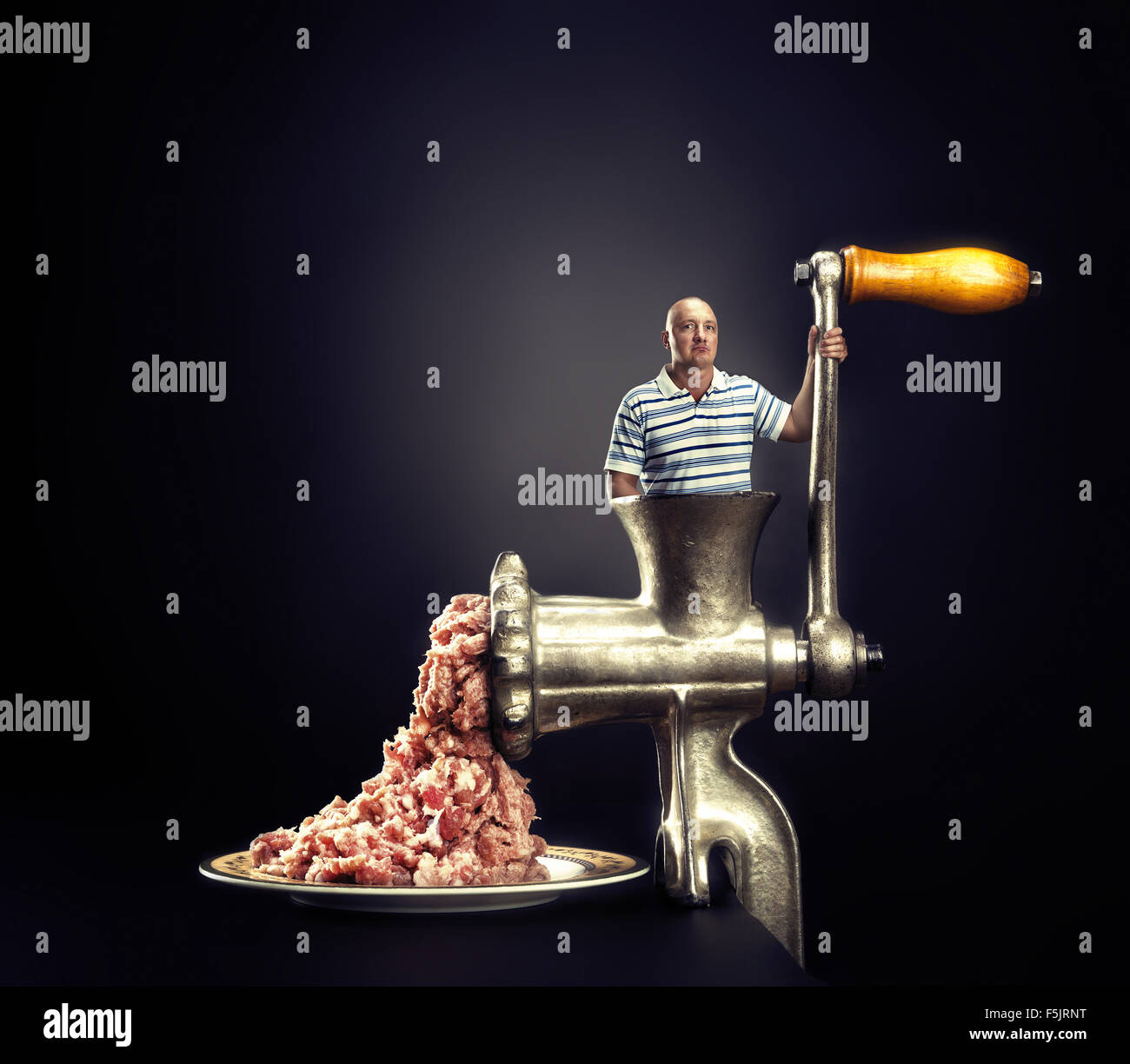 Mincing machine is doing minced from man Stock Photo - Alamy