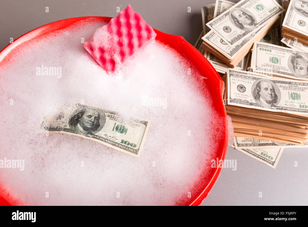 Dollar banknote are washing in soap foam with wisp Stock Photo - Alamy