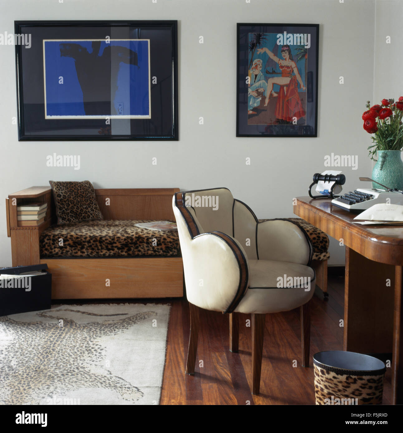 Thirties cream leather chair and veneered desk in a nineties study with ...