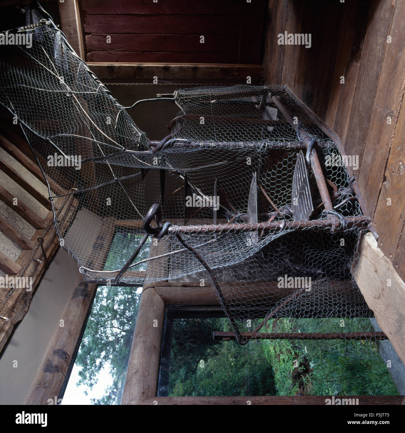 Hand forged staircase made of up-cycled wrought iron and chicken wire ...