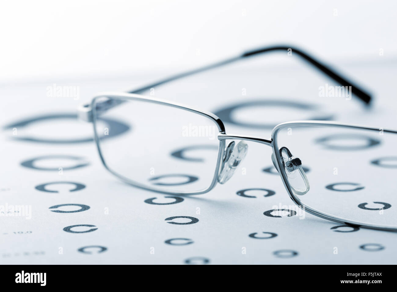 eye-examination-chart-with-glasses-stock-photo-alamy