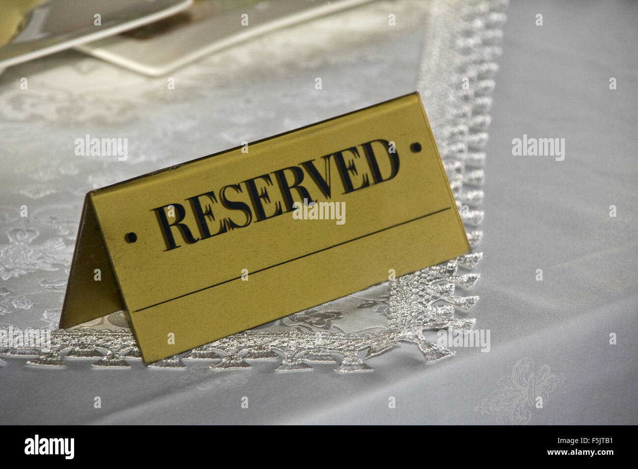 Reserved sign on the table Stock Photo - Alamy