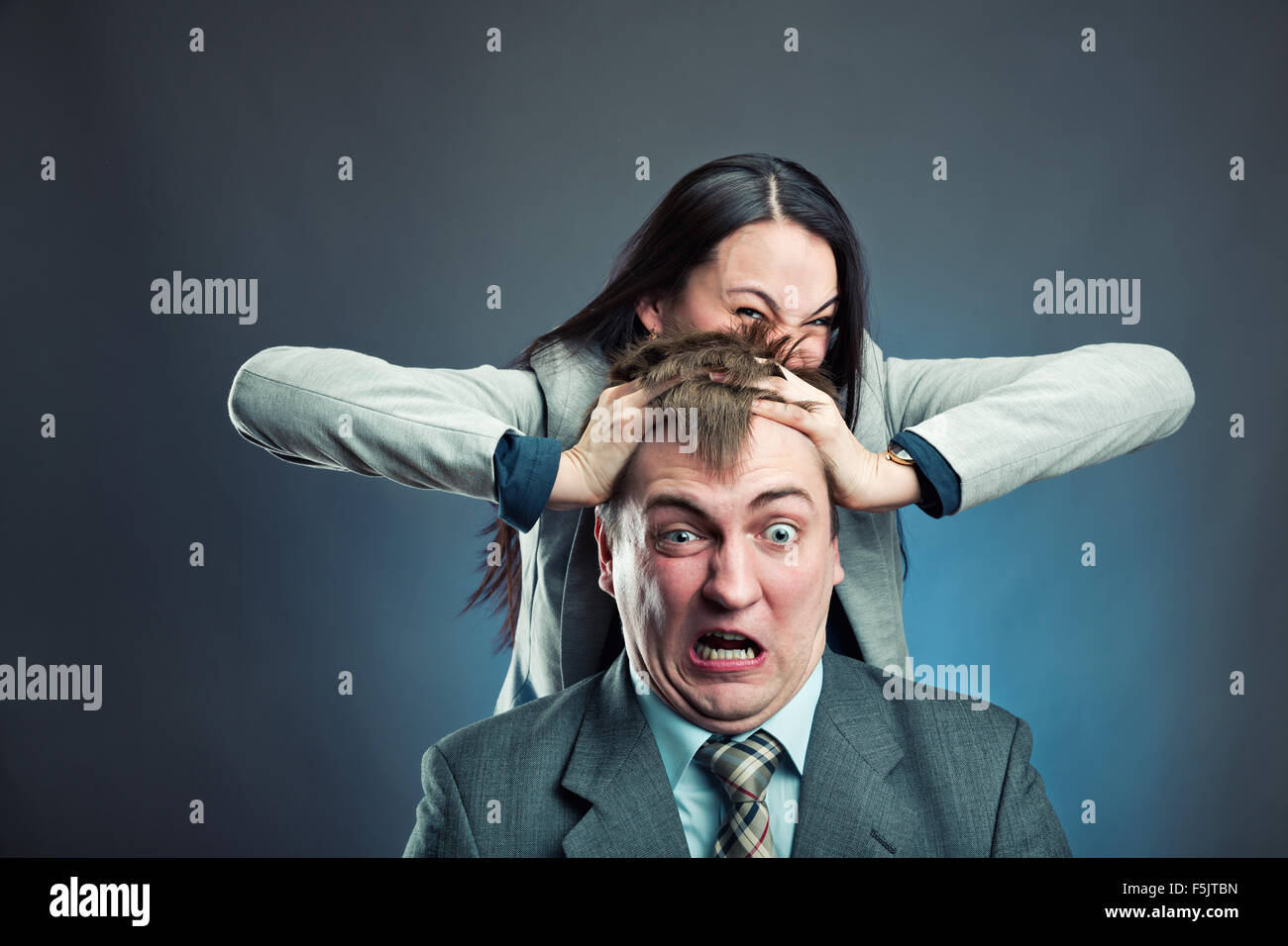 Woman makes pressure on man's head Stock Photo - Alamy