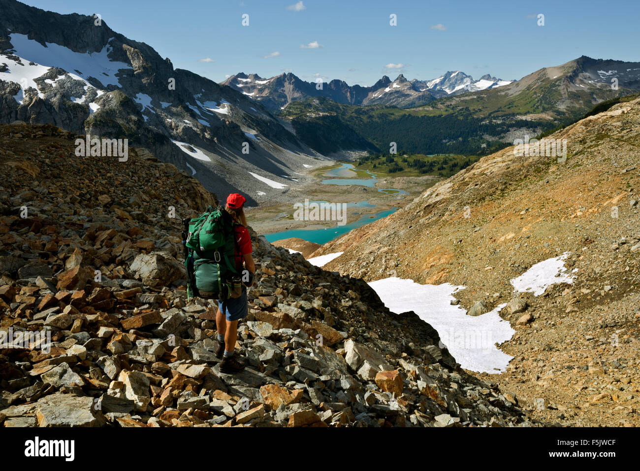 WA10831-00...WASHINGTON - Hiker at Spider Gap overlooking Upper Lyman ...