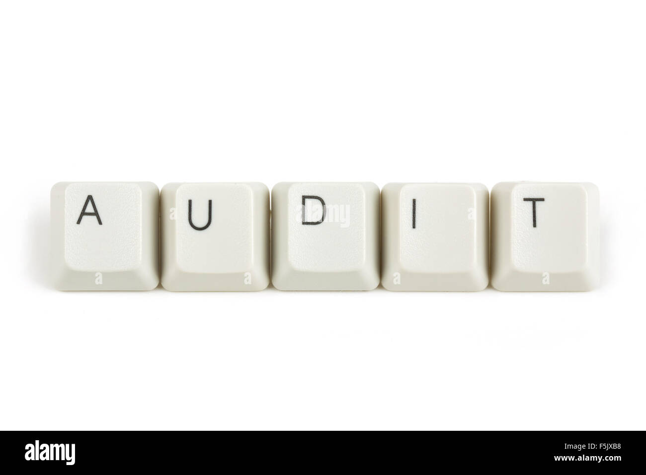 audit text from scattered keyboard keys isolated on white background ...