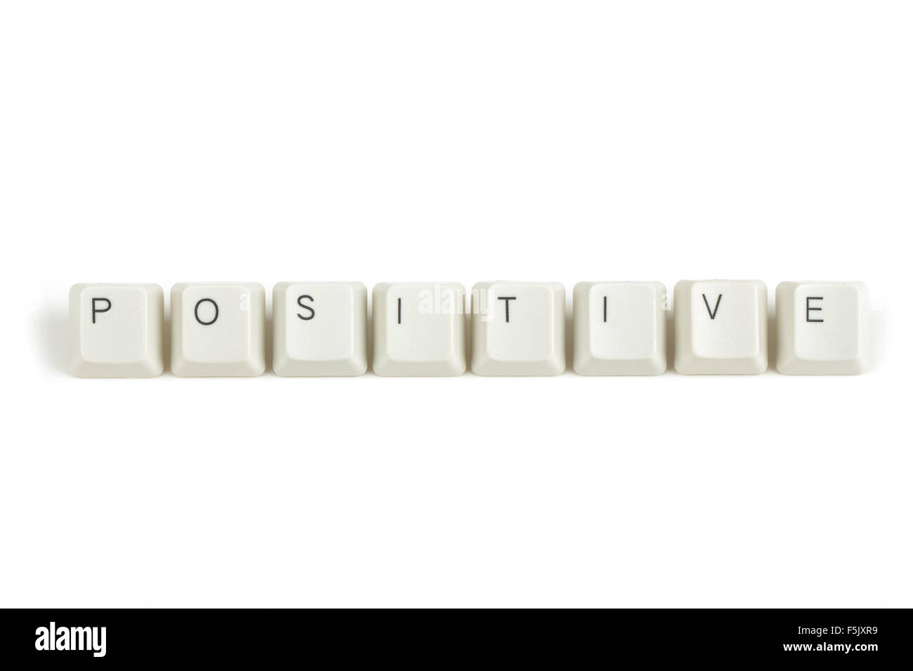 positive text from scattered keyboard keys isolated on white background ...