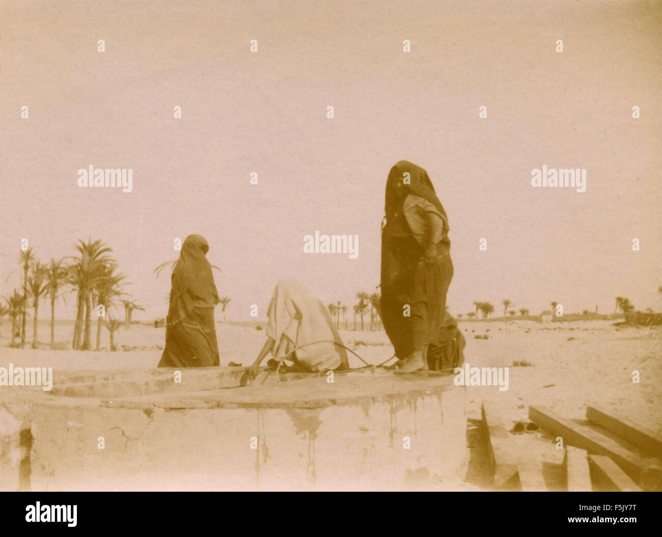 Arab women draw water from the well, Zuara , Libya Stock Photo - Alamy