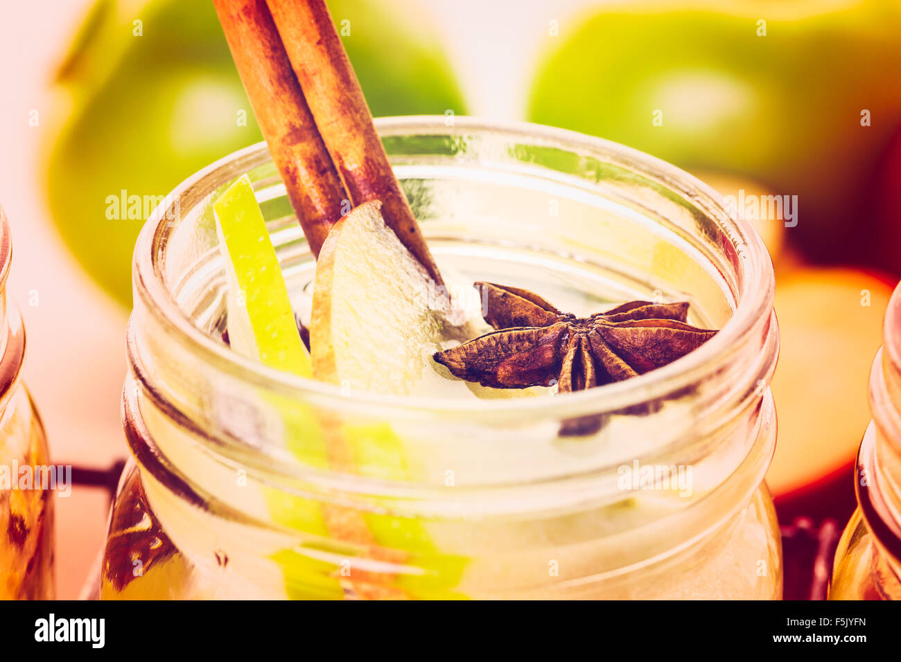 Infused apple water with cinnamon and anise Stock Photo - Alamy