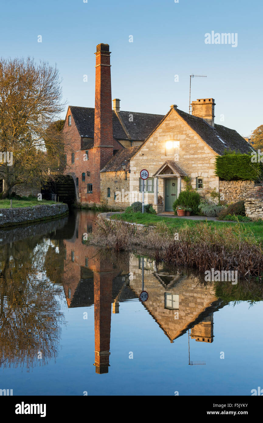 The Old Mill and reflection. Lower Slaughter in the autumn sunshine ...