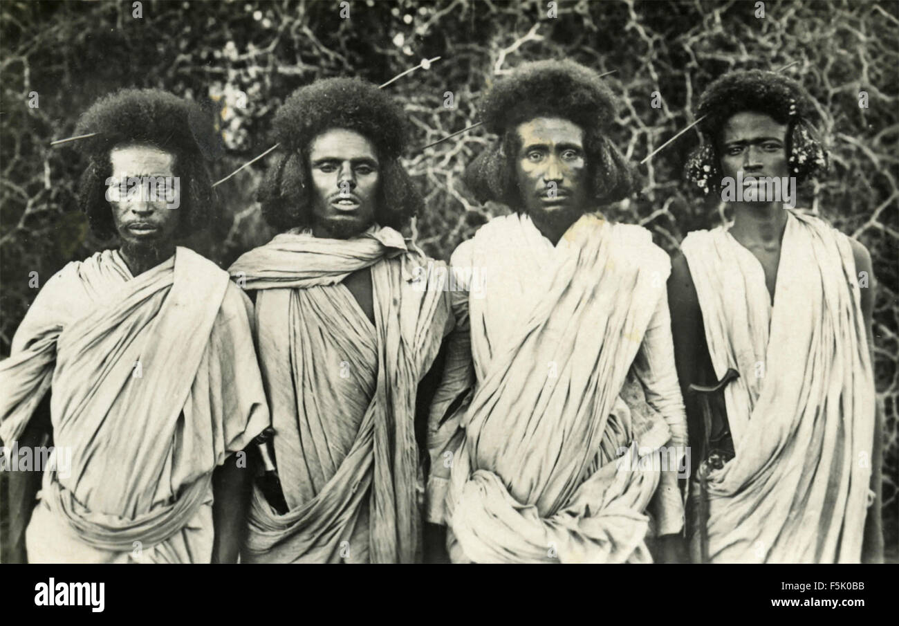 Four young africans traditional clothes hi-res stock photography and ...