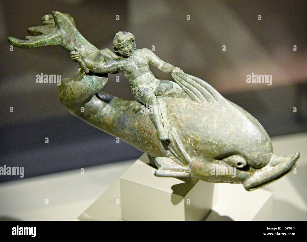 Dolphin and boy statue hi-res stock photography and images - Alamy