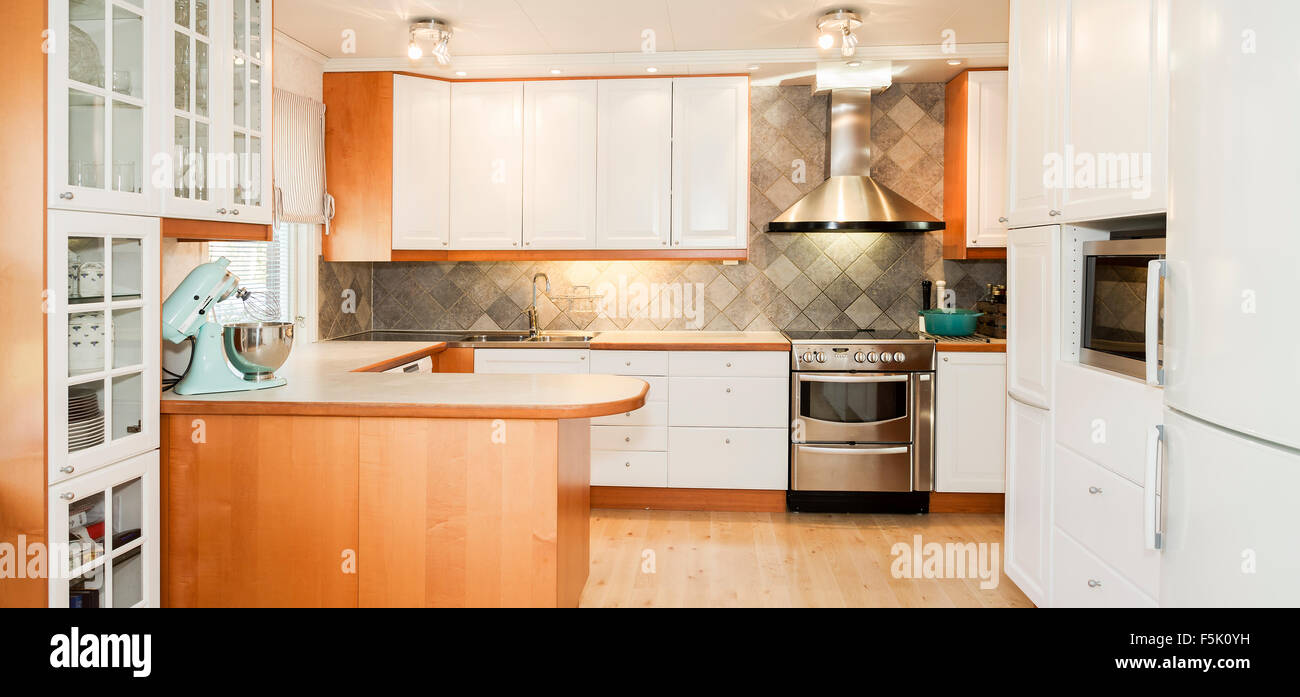 fancy kitchen interior with grey tiles Stock Photo - Alamy