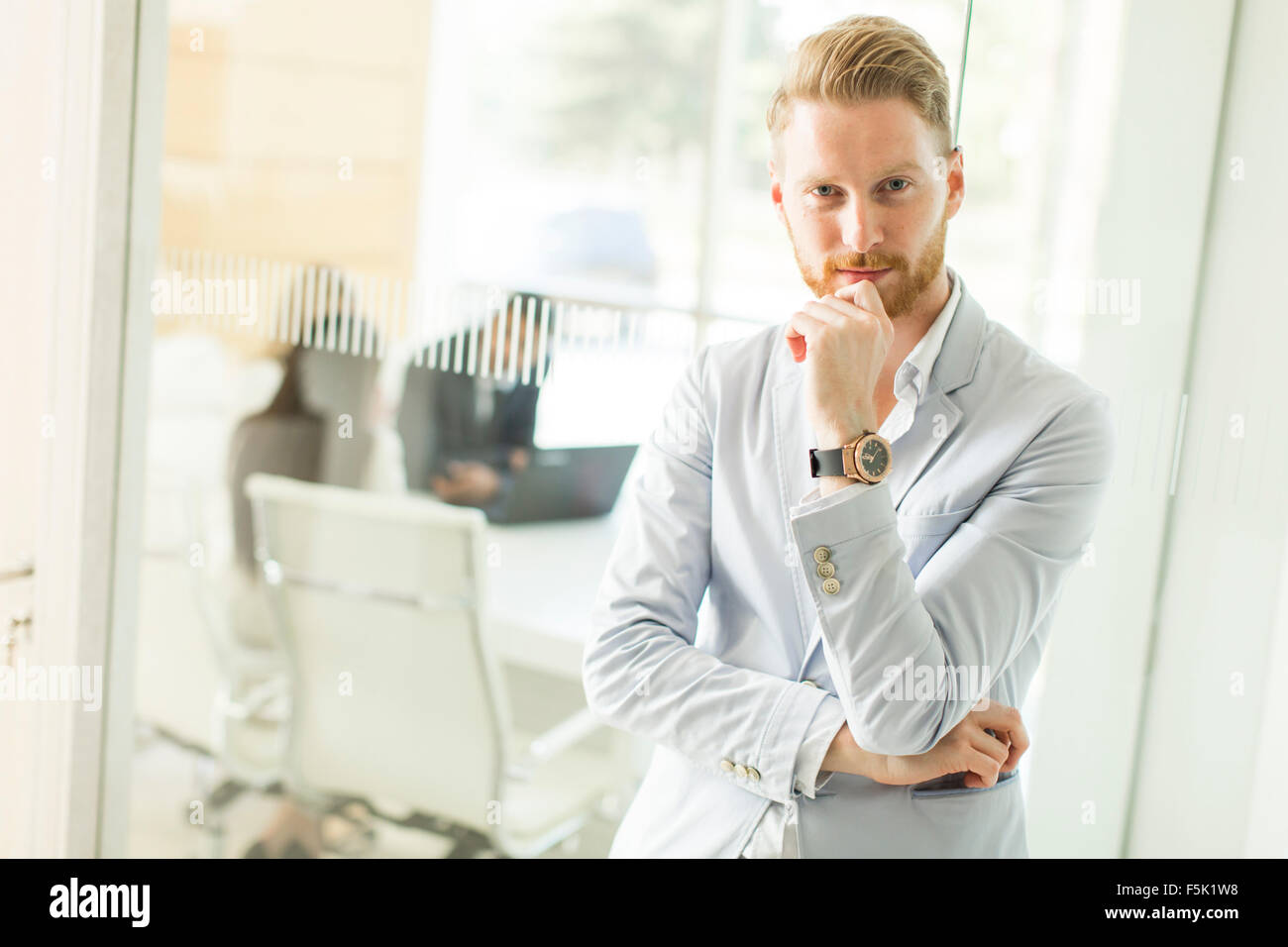 Young man in the office Stock Photo - Alamy