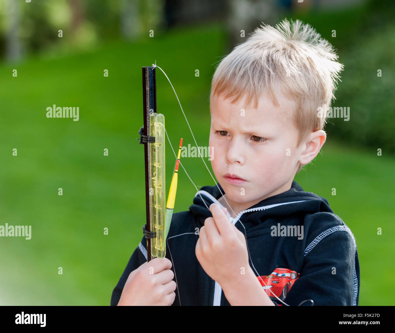 Young boy with fishing-rod Stock Photo - Alamy