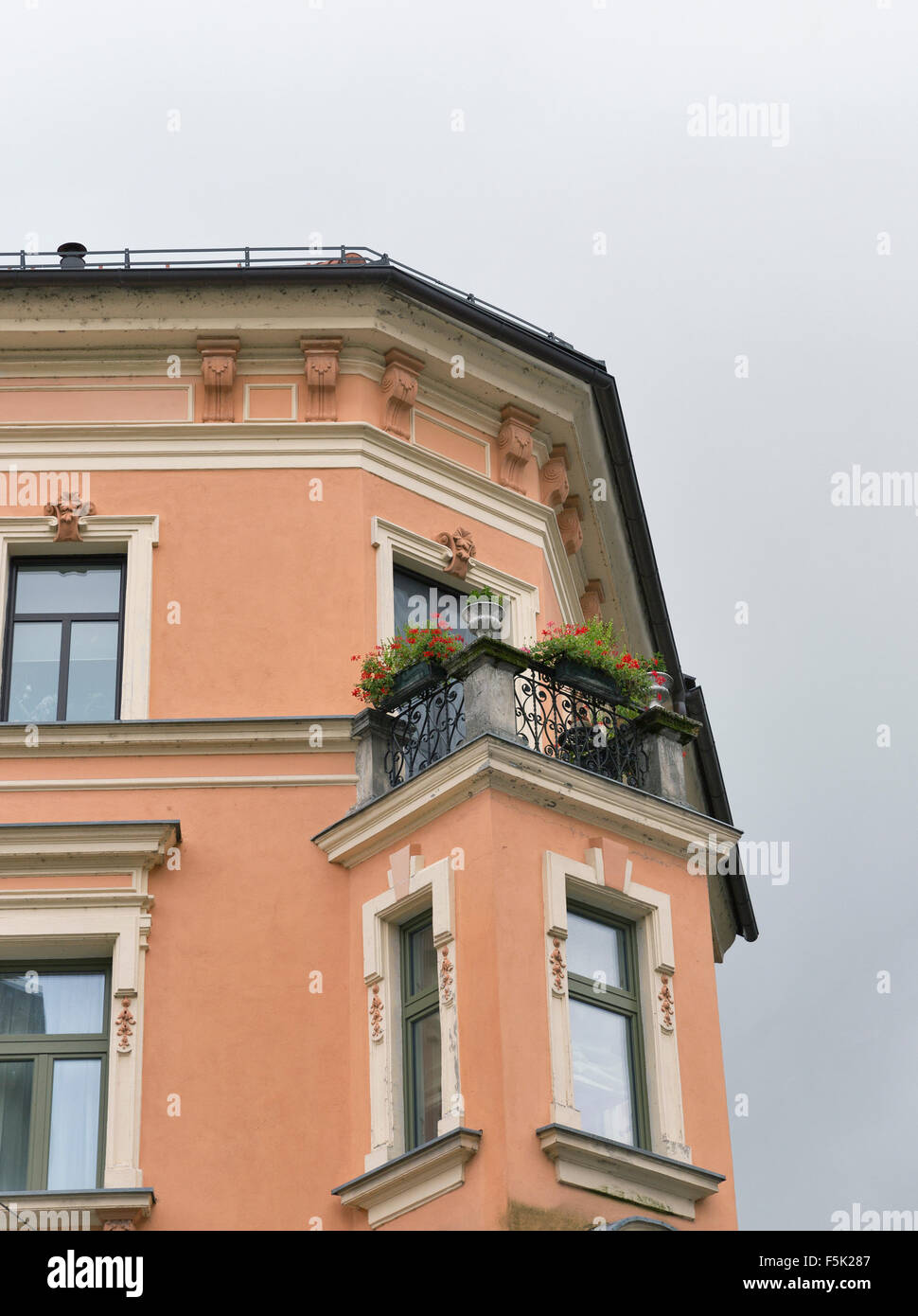Old residential building classic style balcony with flowers in ...