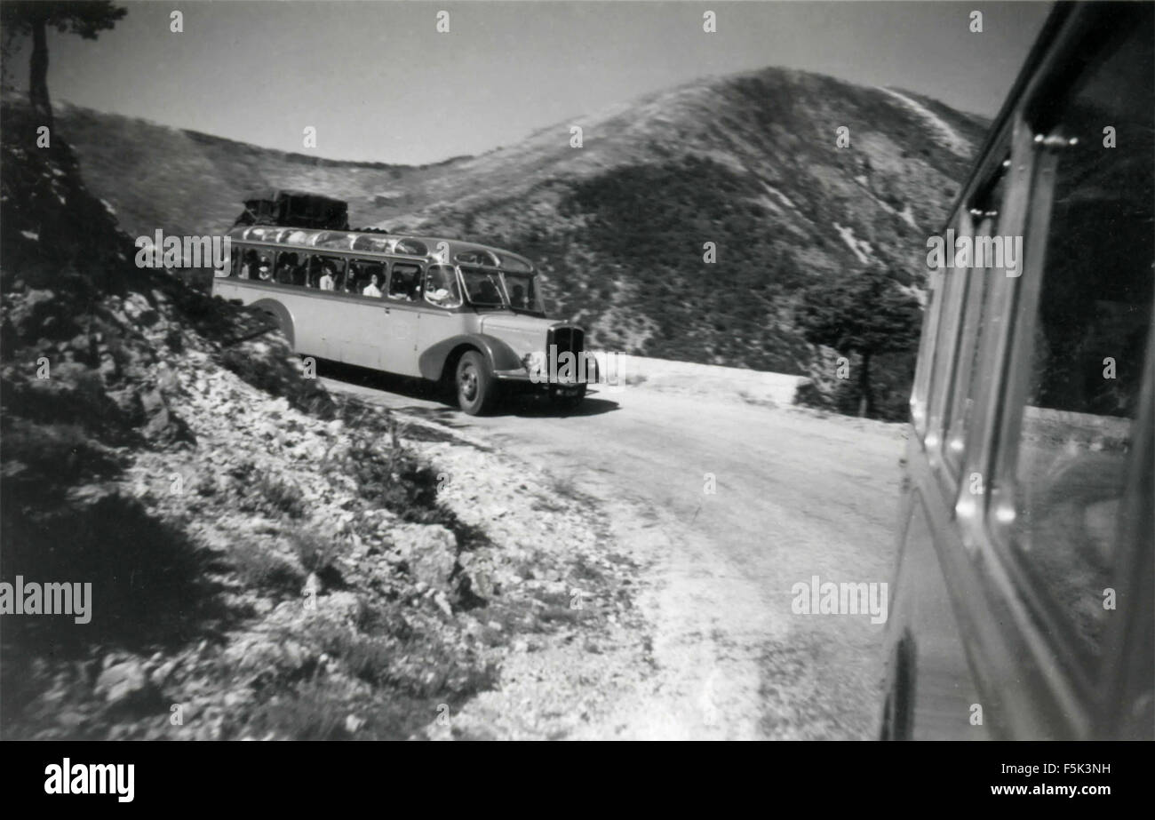 Tourist bus on a mountain road Stock Photo - Alamy