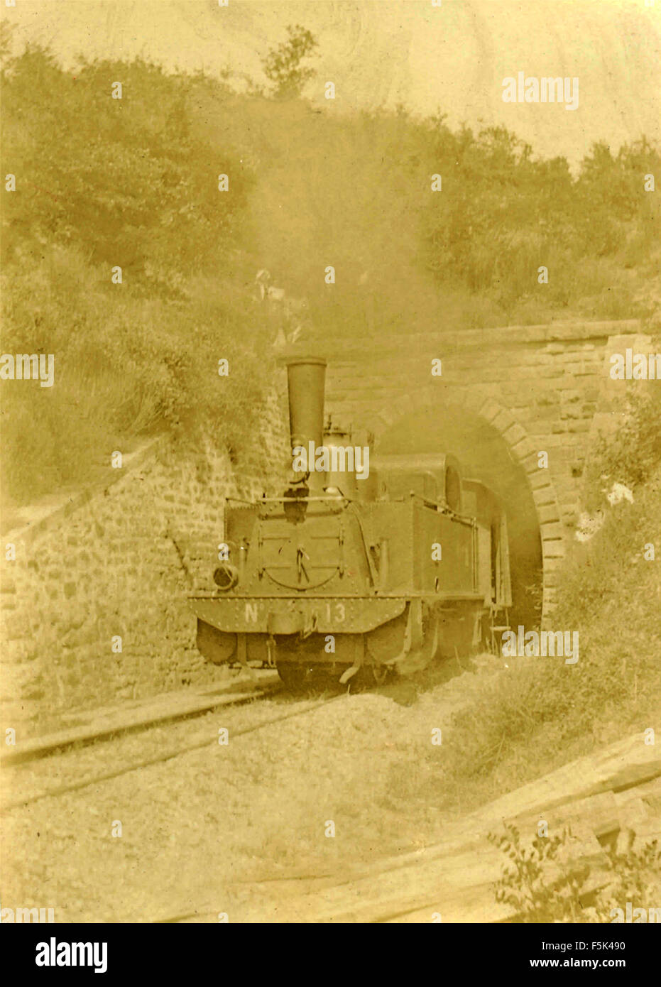 A steam train leaving the tunnel , Italy Stock Photo - Alamy