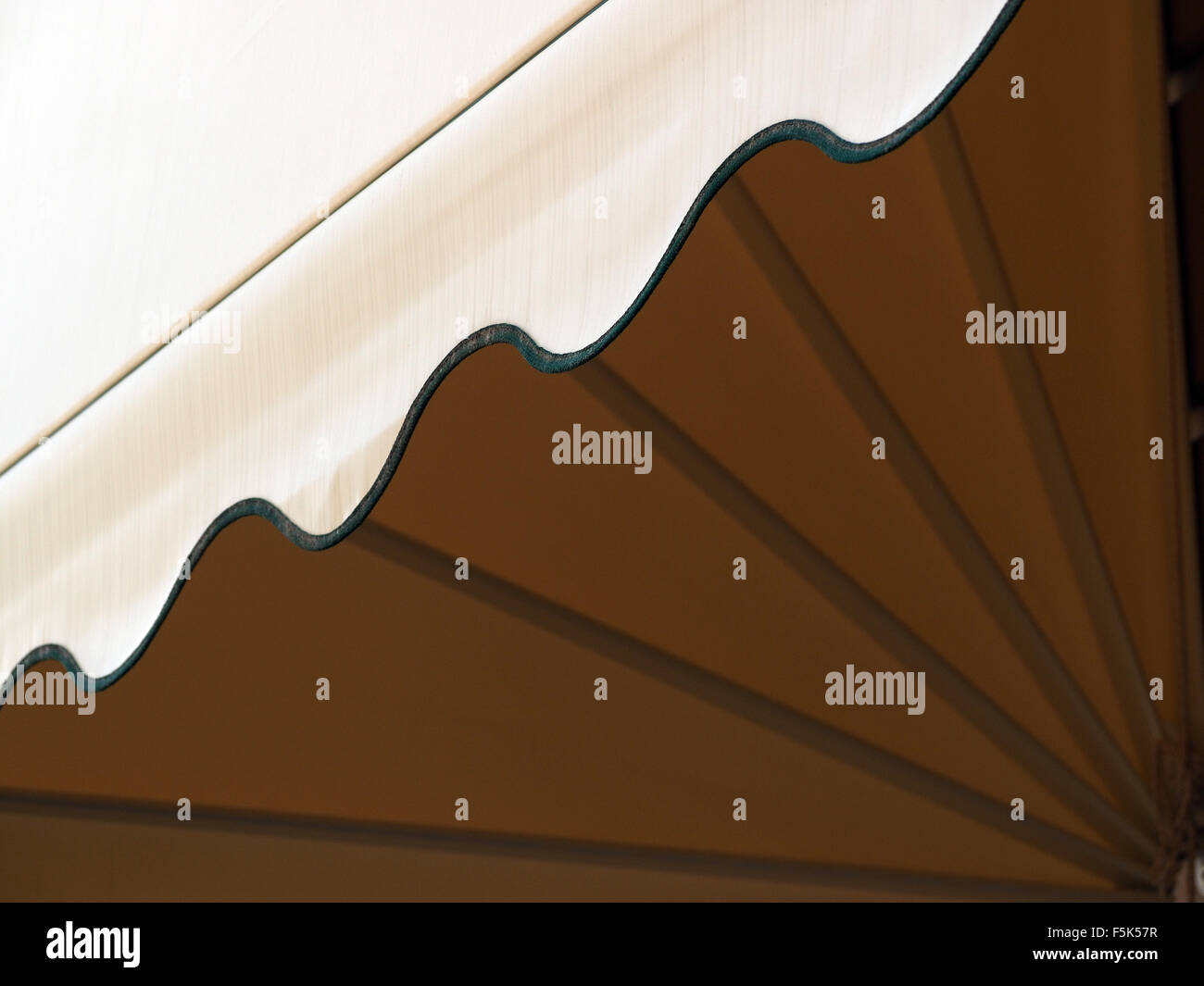 Scallop edged canvas canopy in Tuscany Italy with radiating spoke spars ...