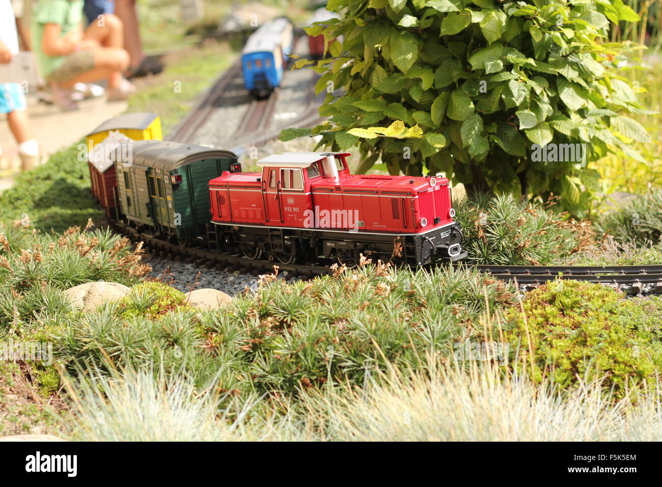 Model train on a miniature railway line Stock Photo - Alamy