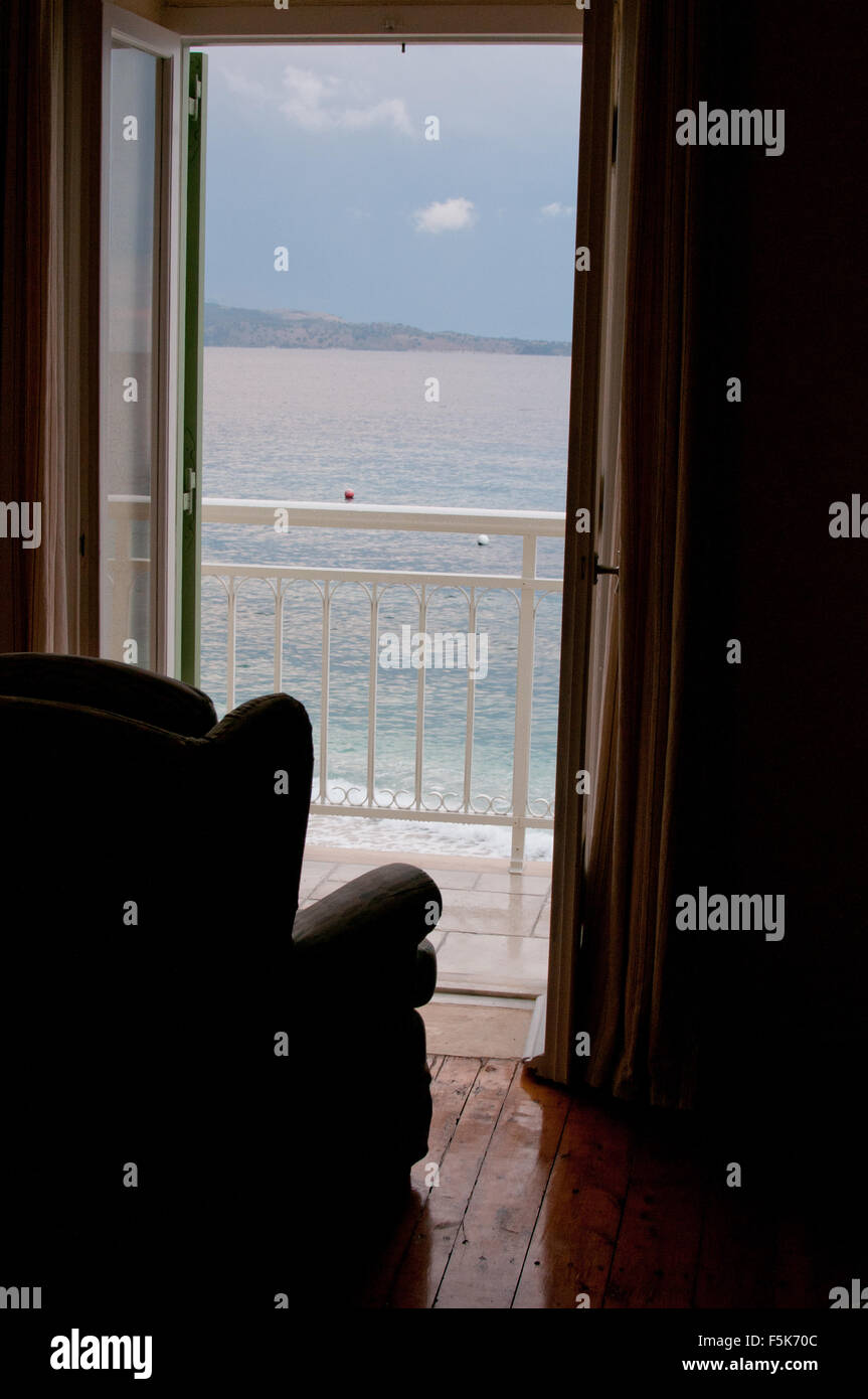armchair in window overlooking sea Stock Photo - Alamy