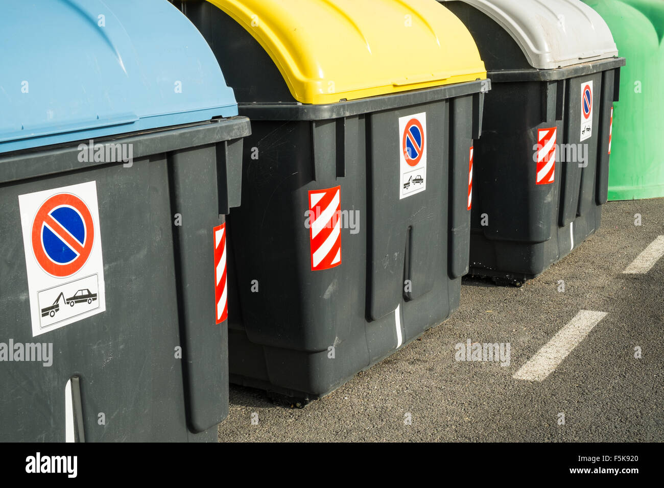 Containers in different colors to collect recyclable waste Stock Photo ...