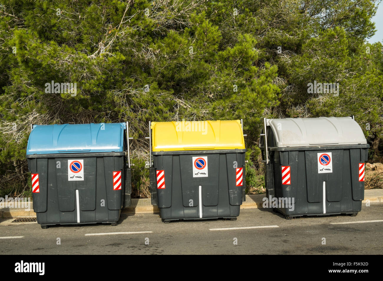 Containers in different colors to collect recyclable waste Stock Photo ...