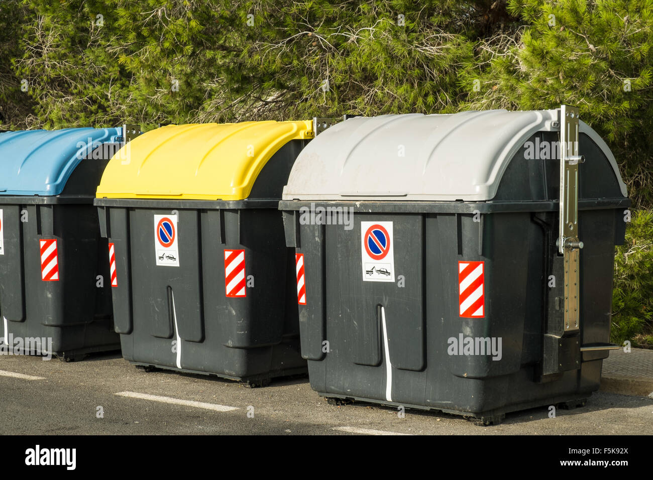 Containers in different colors to collect recyclable waste Stock Photo ...