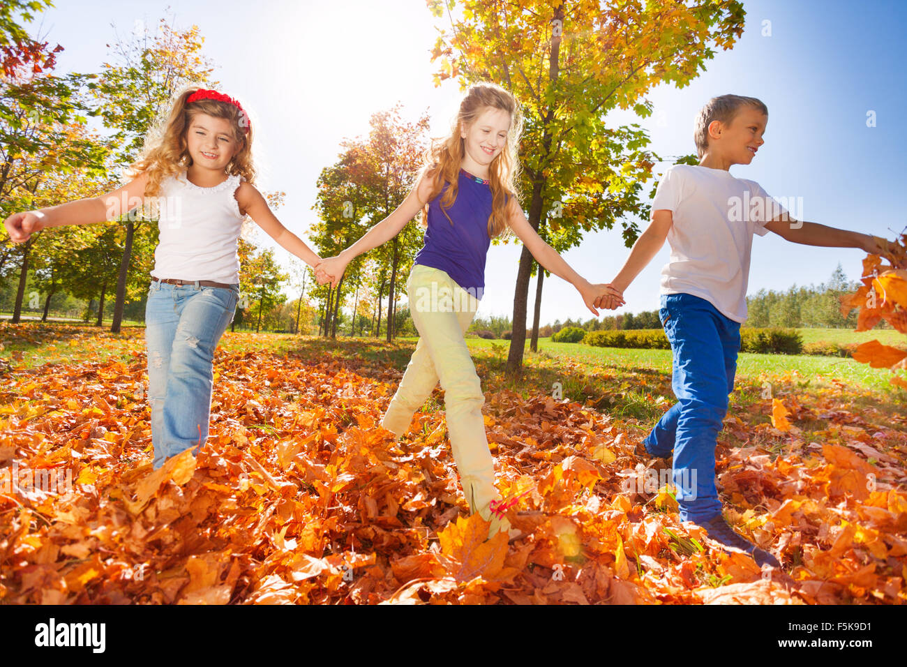 Happy children play in the park hi-res stock photography and images - Alamy