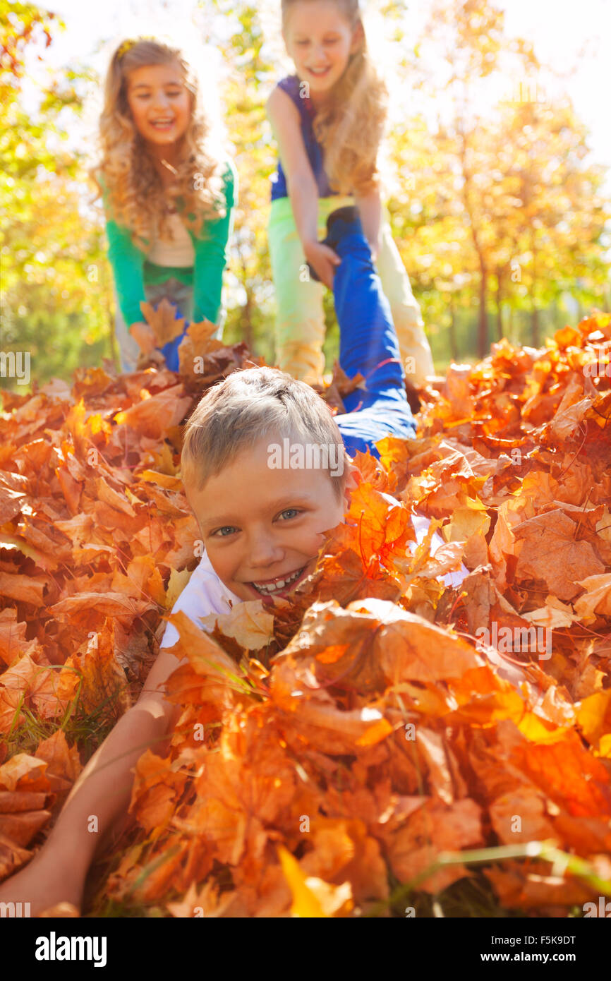 Child dragging tree hi-res stock photography and images - Alamy