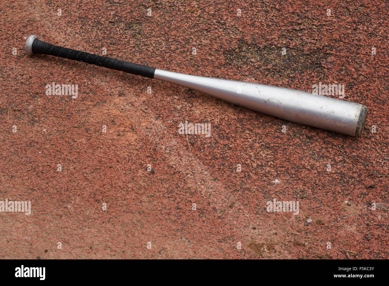 baseball bat on a rubber background Stock Photo - Alamy