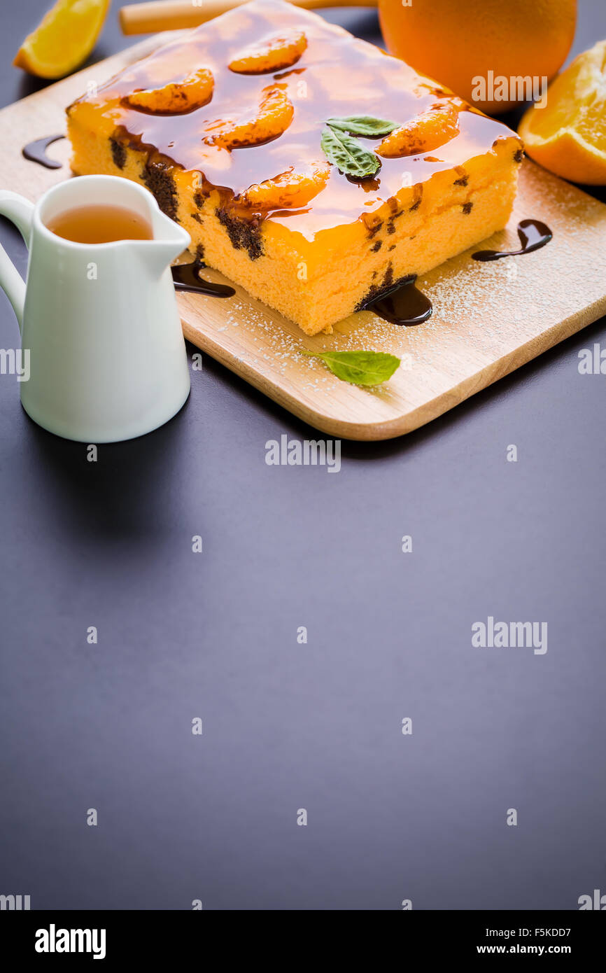 Orange cake with chocolate sauce for tea break Stock Photo - Alamy