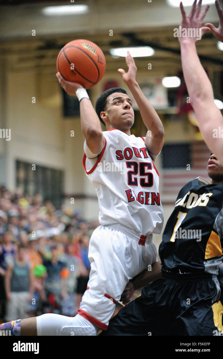 Player sites his target as he shoots over the close defense from an ...